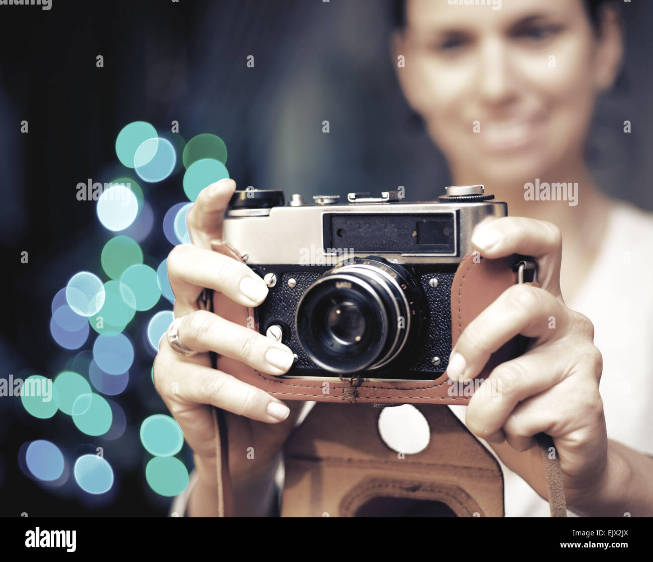 Smiling woman photographed retro camera. Vintage image processing Stock ...