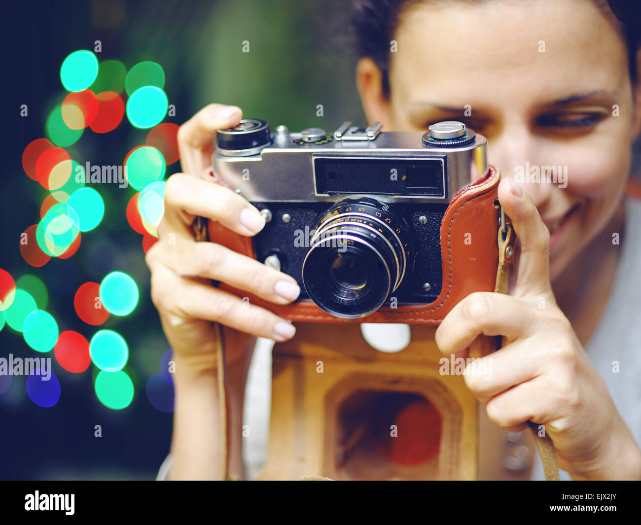 Smiling woman photographed retro camera. Vintage image processing Stock ...
