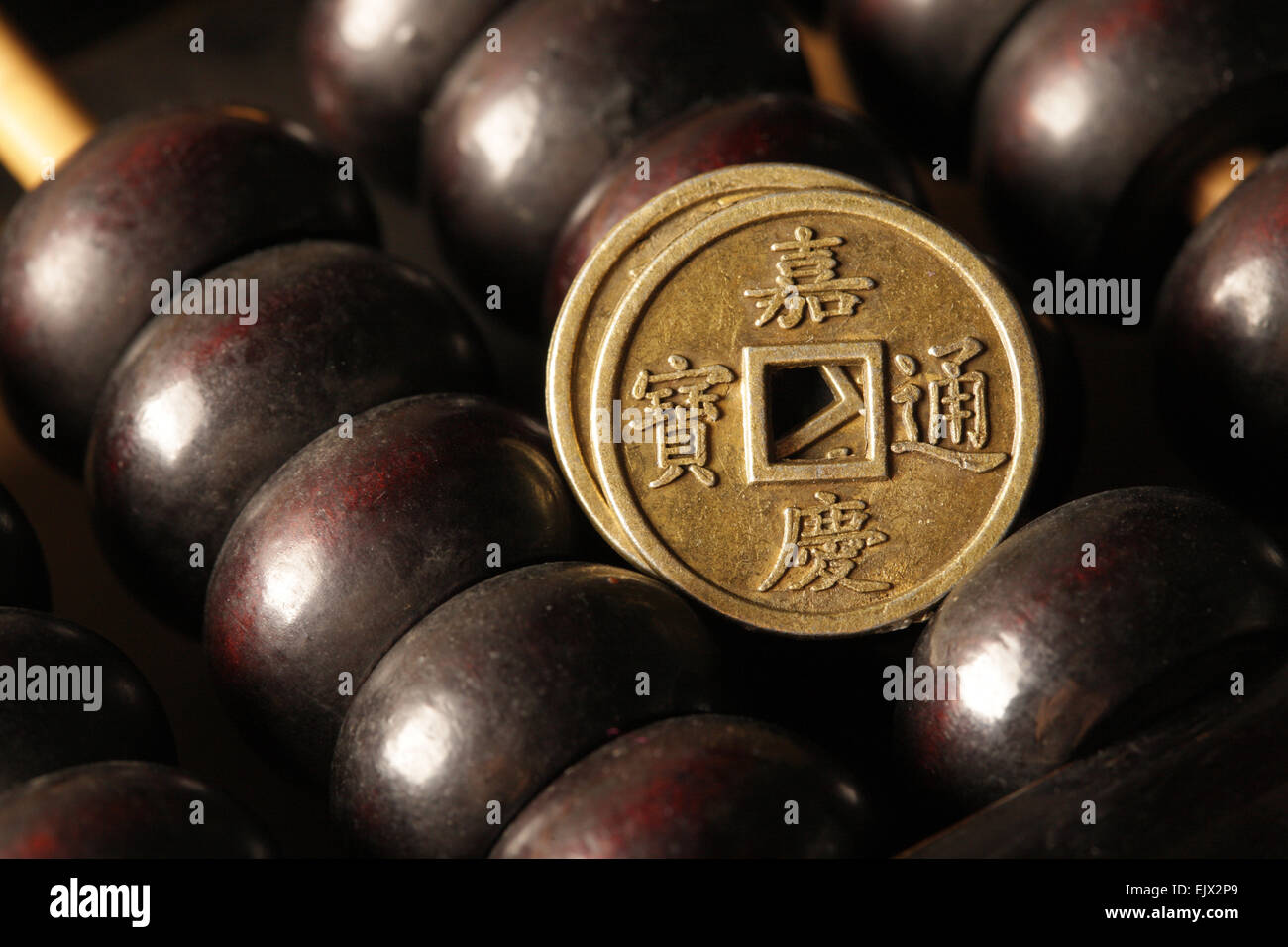 Coins and abacus Stock Photo - Alamy