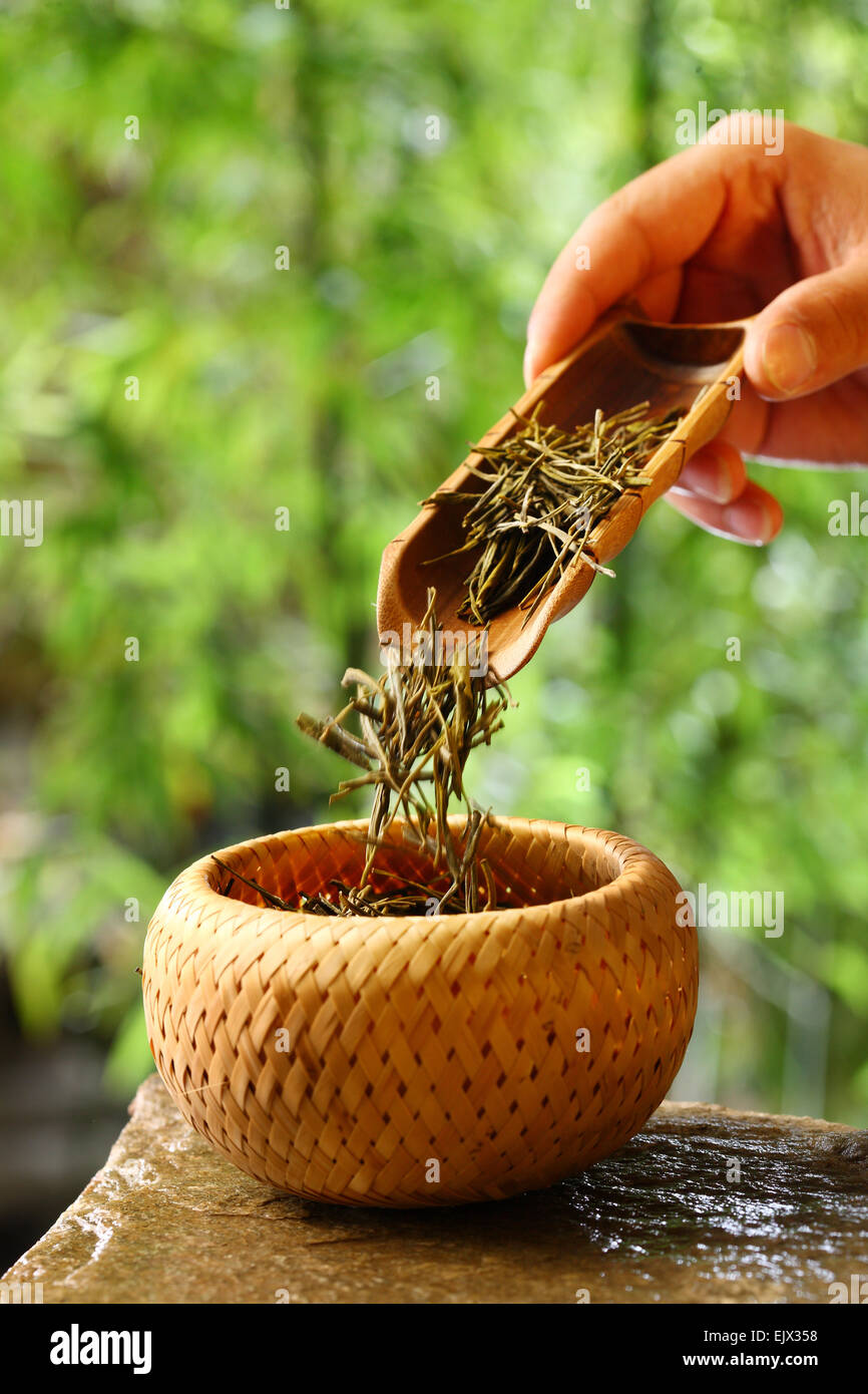 One hand in the pouring tea Stock Photo - Alamy