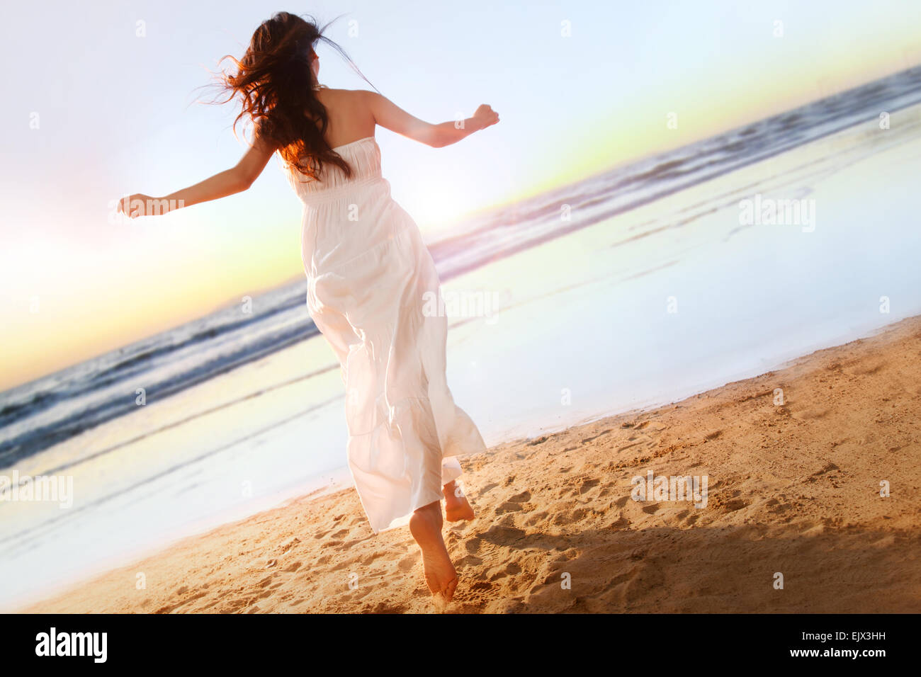A young woman ran on the beach Stock Photo - Alamy