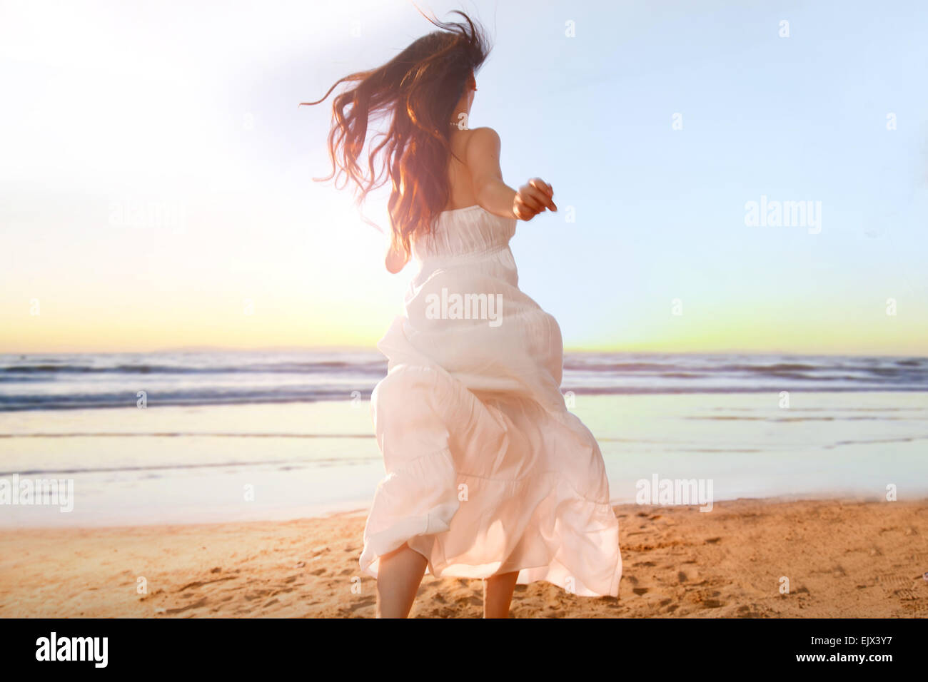 A young woman ran on the beach Stock Photo - Alamy