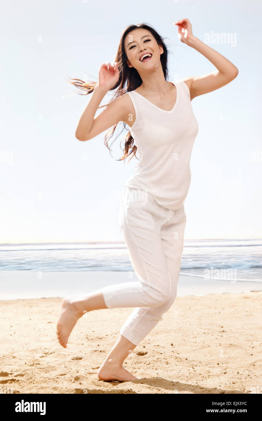 A young woman ran on the beach Stock Photo - Alamy