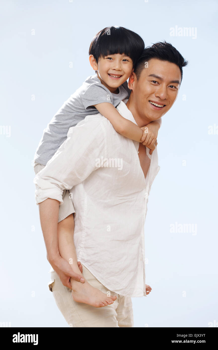 Father carrying his son hi-res stock photography and images - Alamy