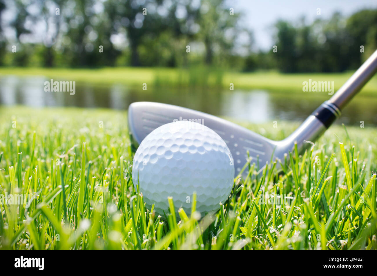 Golf ball and club Stock Photo - Alamy