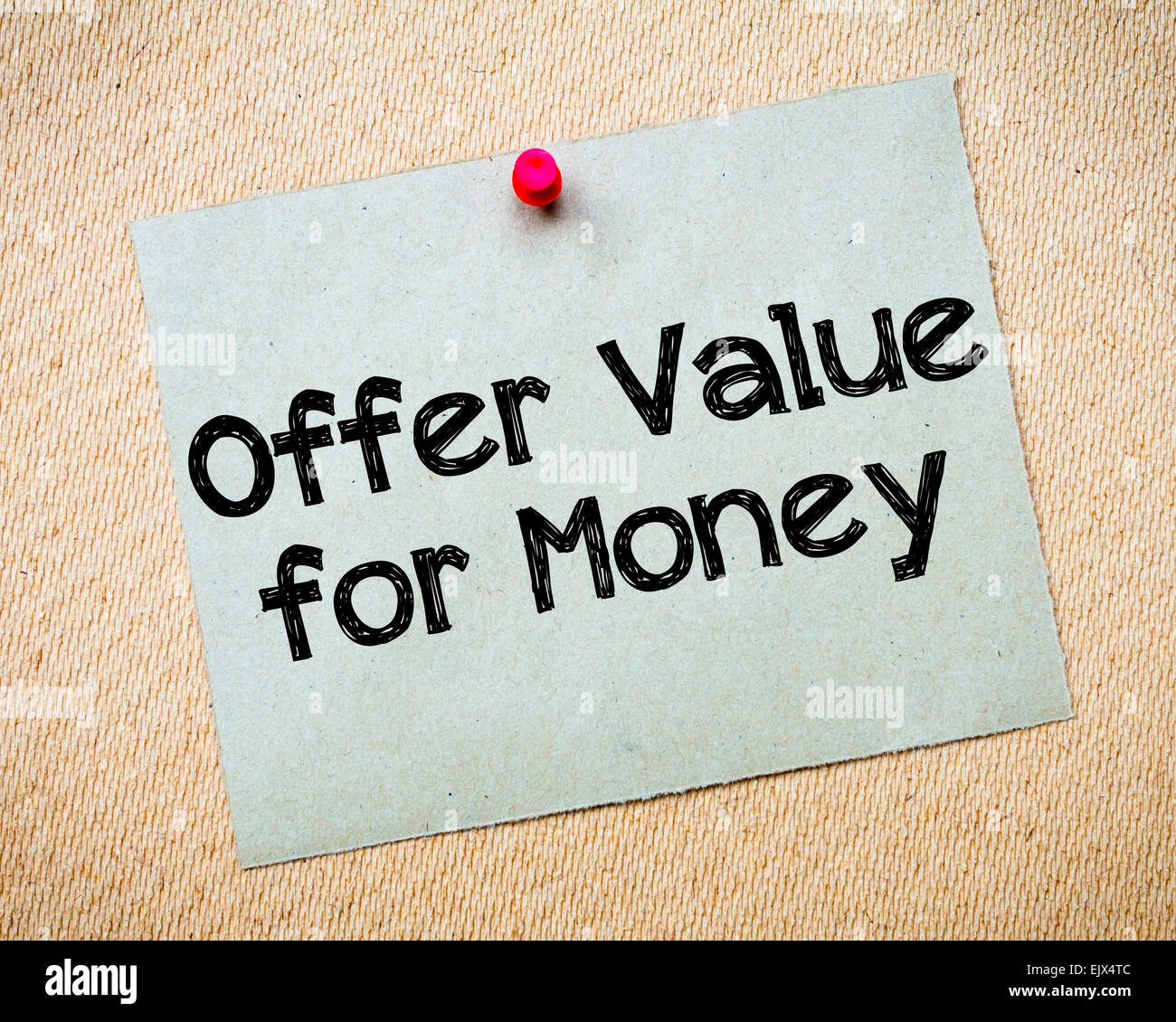 Offer Value for Money Message. Recycled paper note pinned on cork board ...
