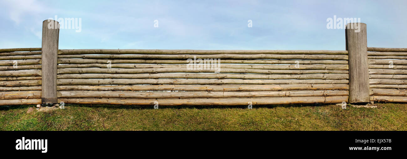 The panoramic image of very long rural fence against the sky made of ...
