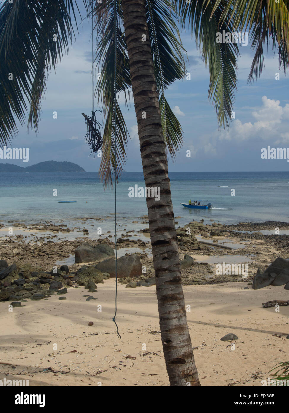 Tourists on a boat on a beach in Tioman island, Malaysia Stock Photo ...