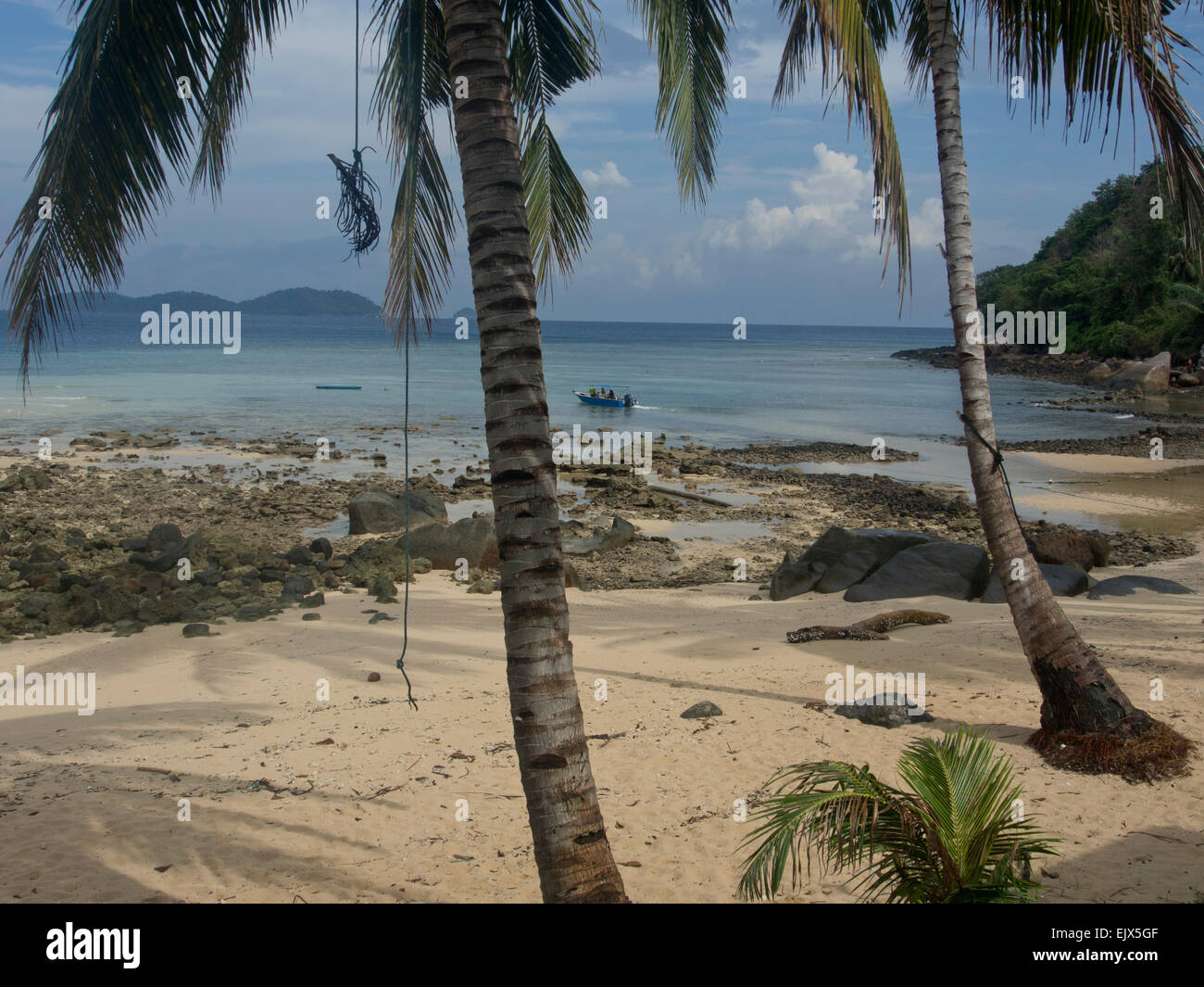 Tourists on a boat on a beach in Tioman island, Malaysia Stock Photo ...