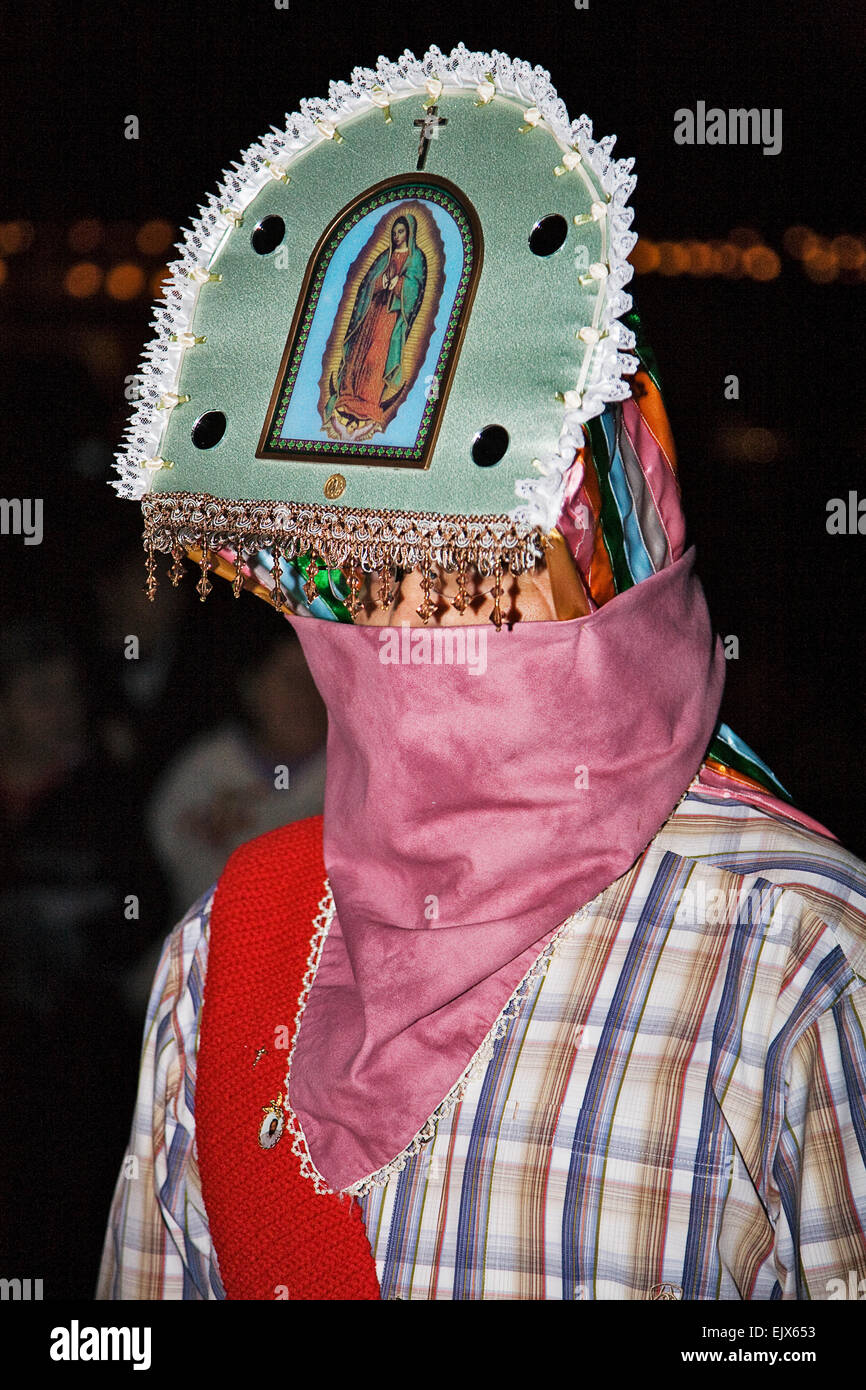A veiled Matachine dancers is part of the celebration of the Virgin of ...