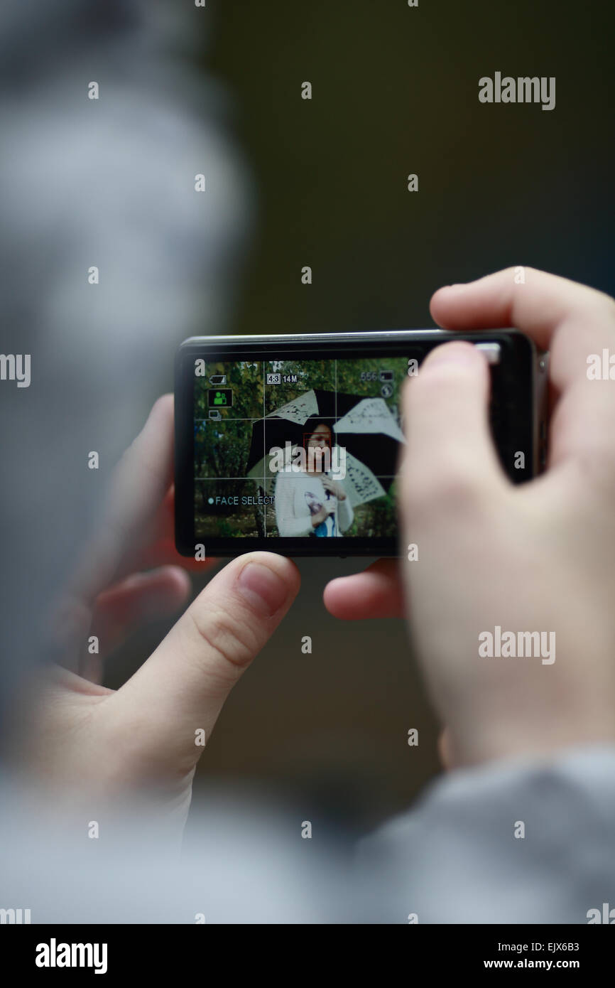 view camera by photographer Woman model in the viewfinder Stock Photo ...