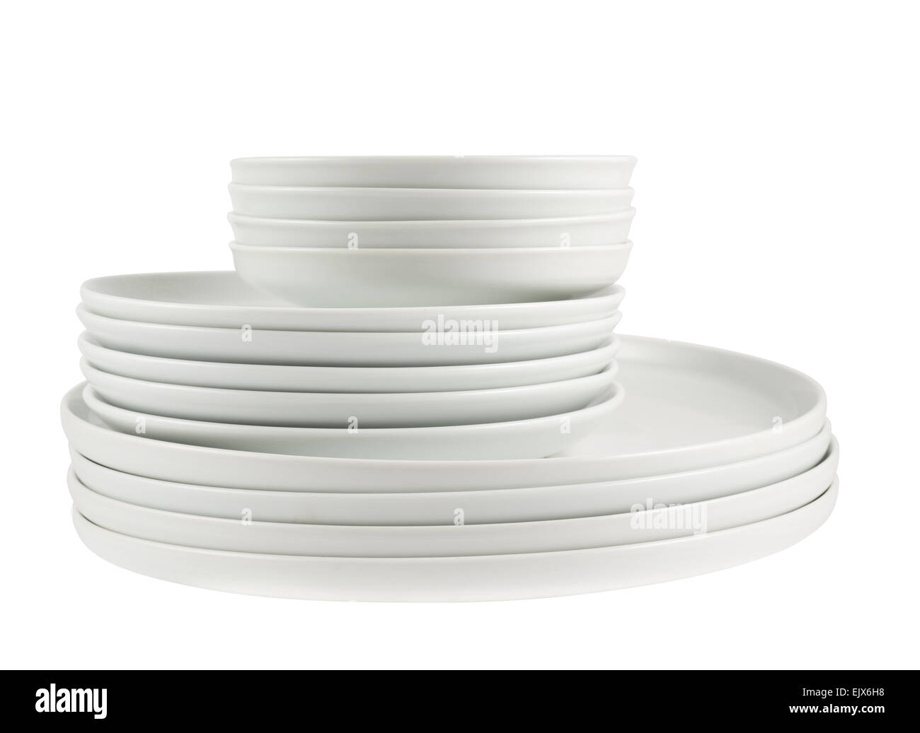 Pile of clean white dish plates isolated Stock Photo - Alamy