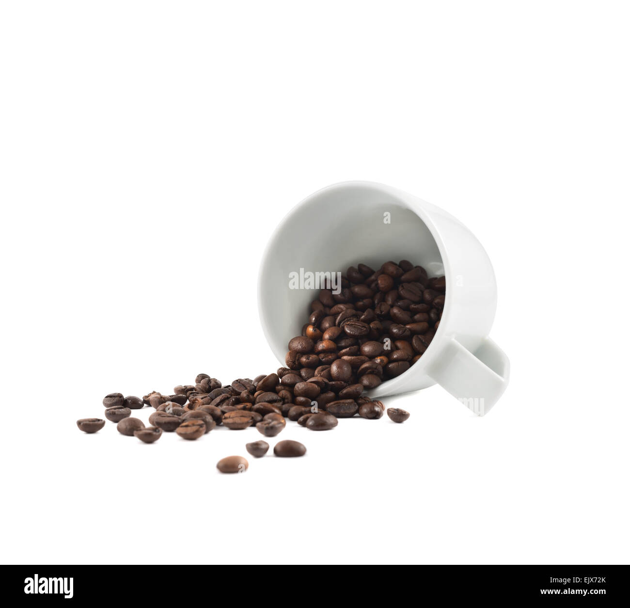 Spilled coffee beans from the cup isolated Stock Photo - Alamy