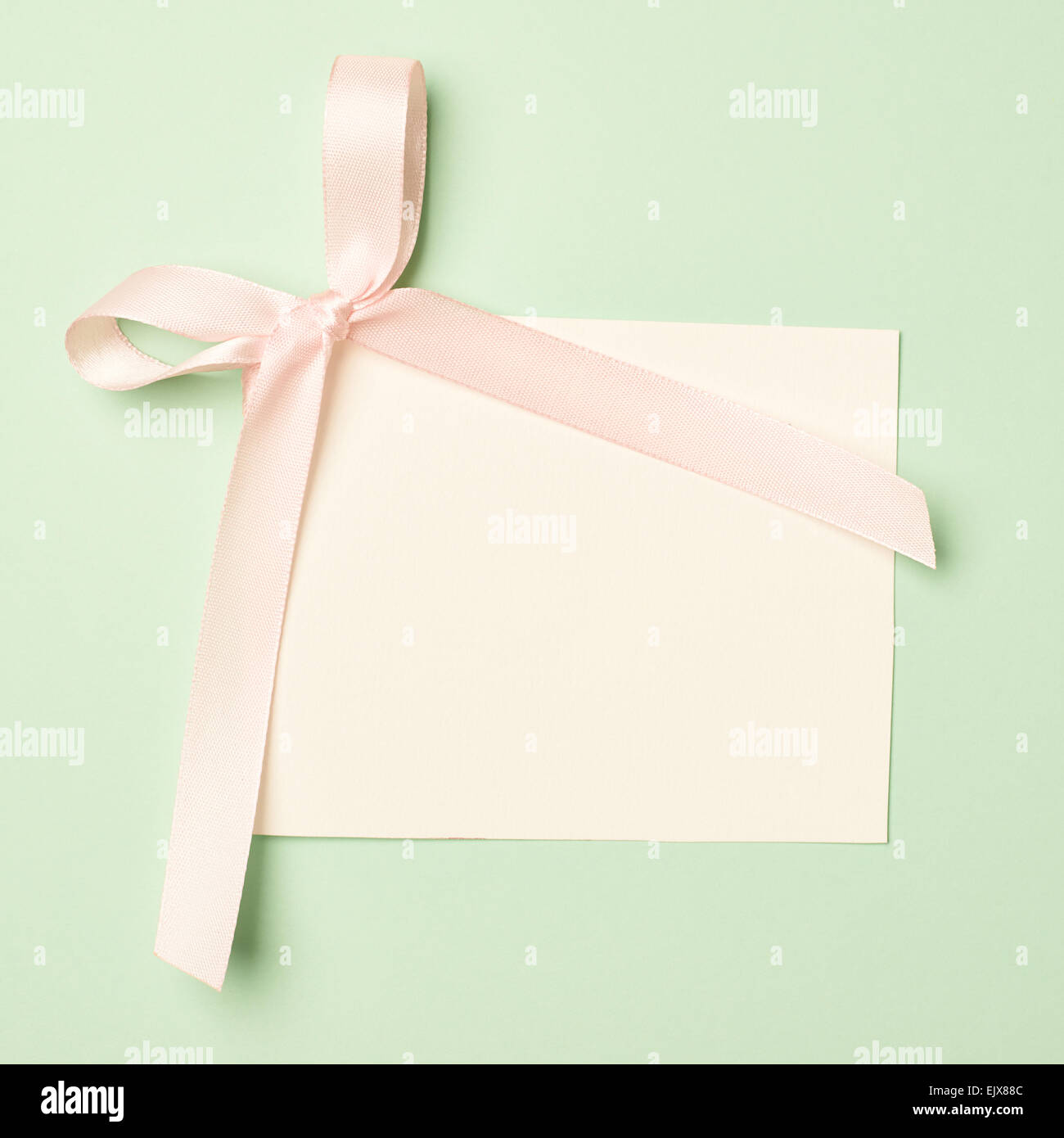 Empty greeting card over a mint green background Stock Photo - Alamy
