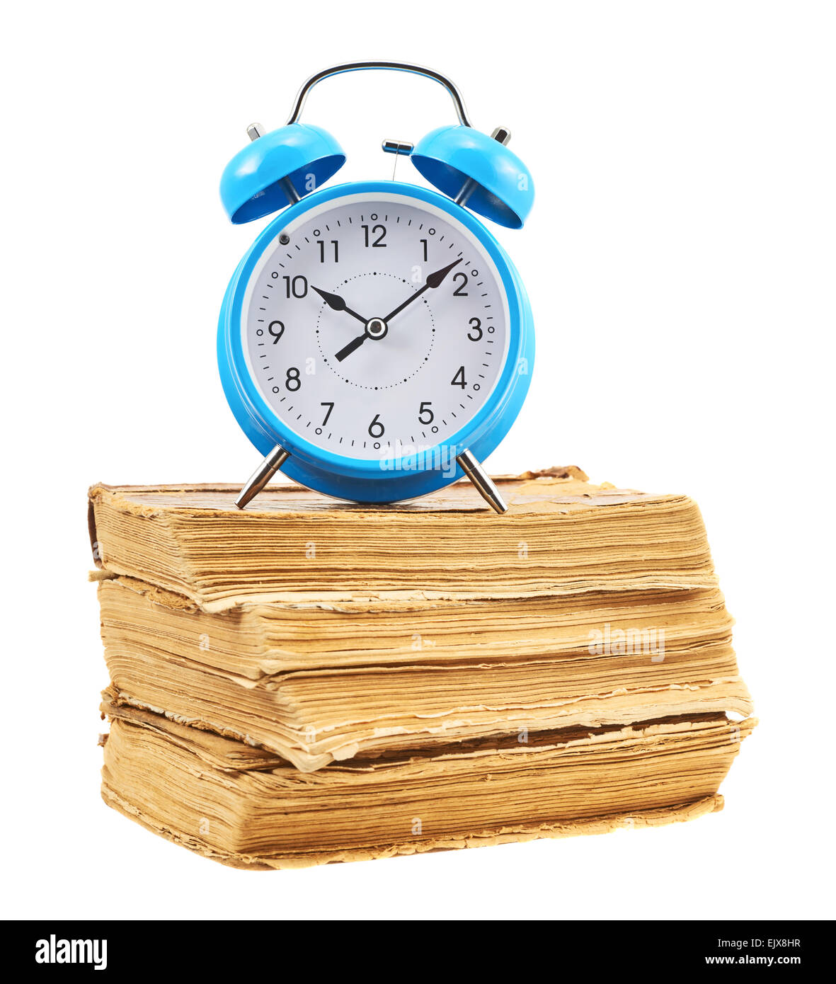 Alarm clock on the stack of books Stock Photo - Alamy