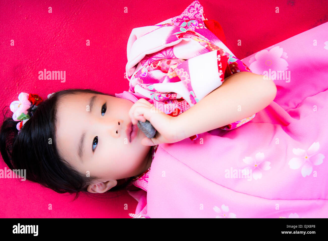 A Japanese girl n pink kimono for her celebration Stock Photo - Alamy