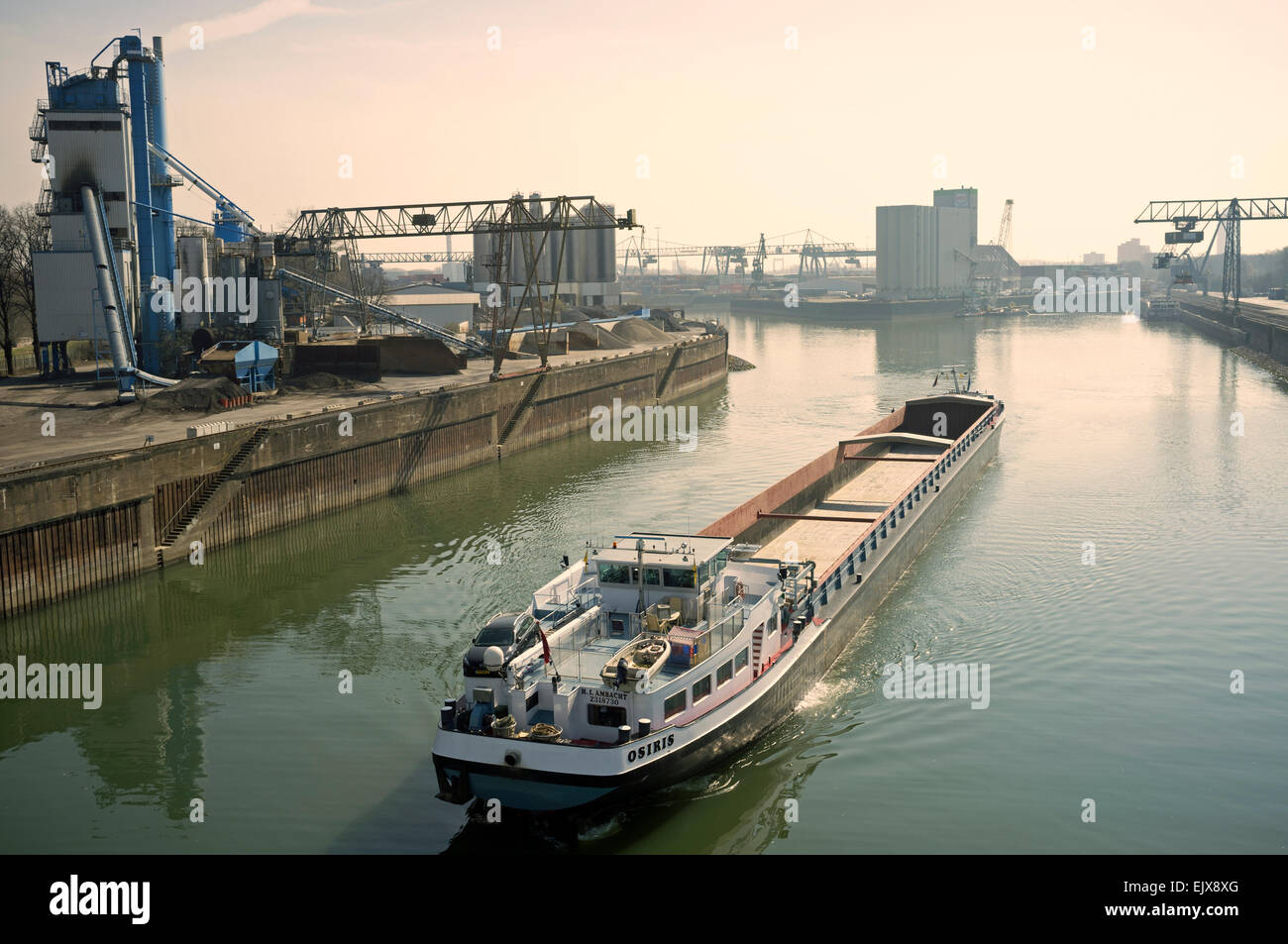 Barge reversing out of port Stock Photo - Alamy