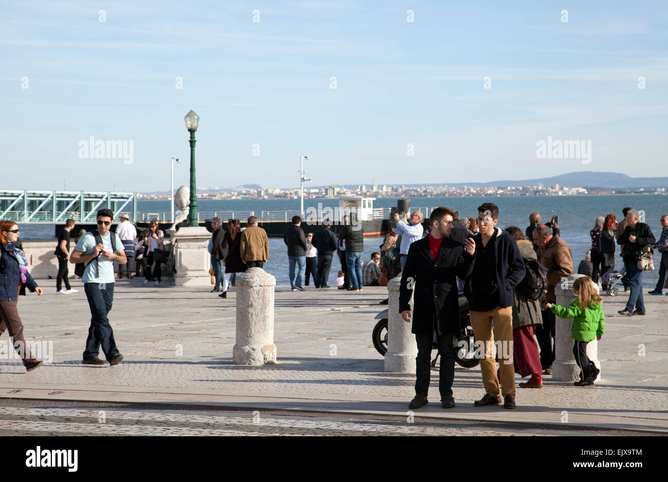 Strolling along Tagus River Promenade in Lisbon - Portugal Stock Photo ...