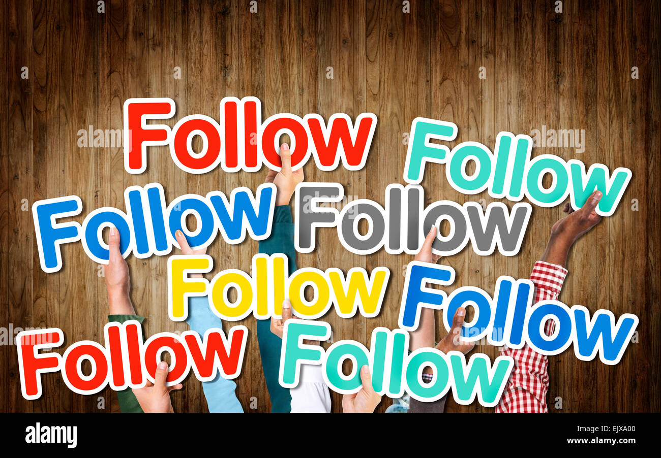 Group of Hands Holding the Word Follow Stock Photo - Alamy