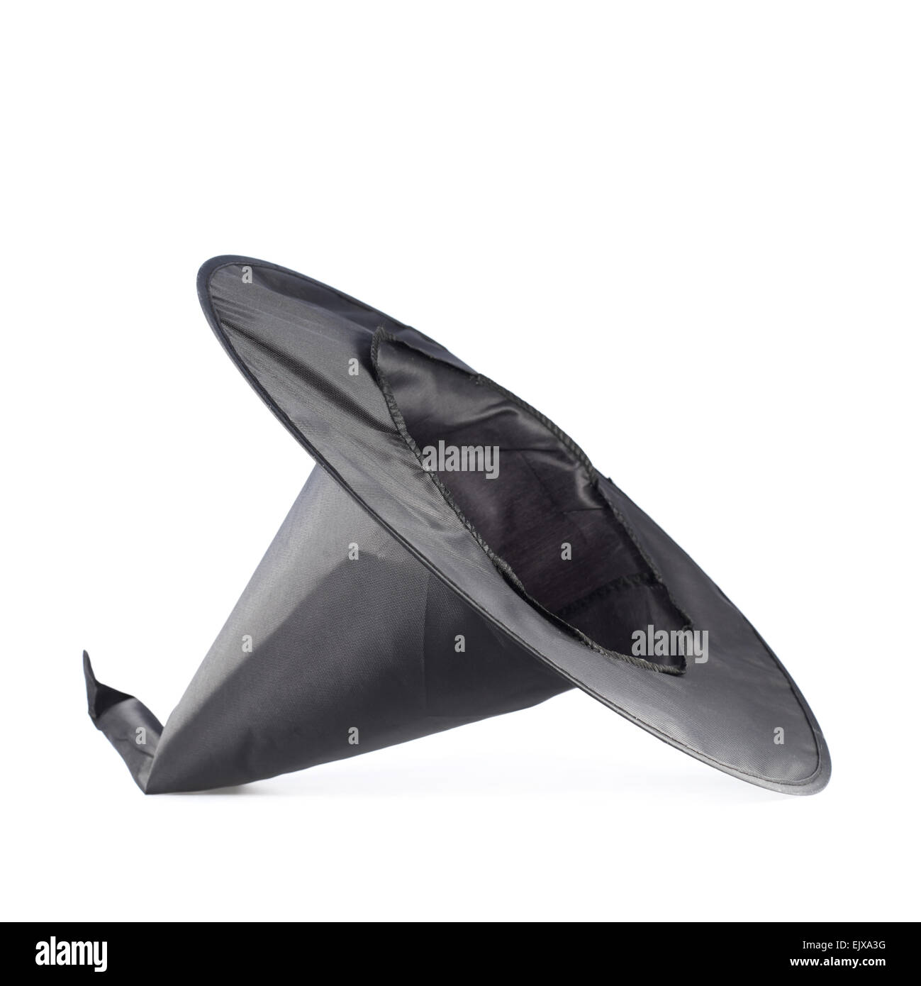 Black pointed cone shaped hat Stock Photo - Alamy