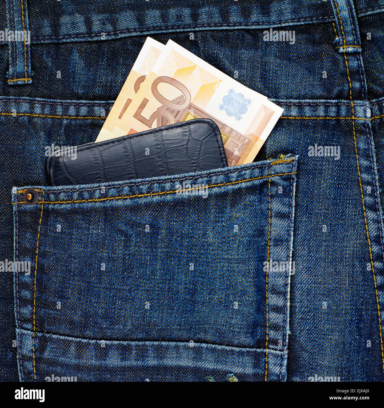 Wallet in a back pocket of a jeans Stock Photo - Alamy