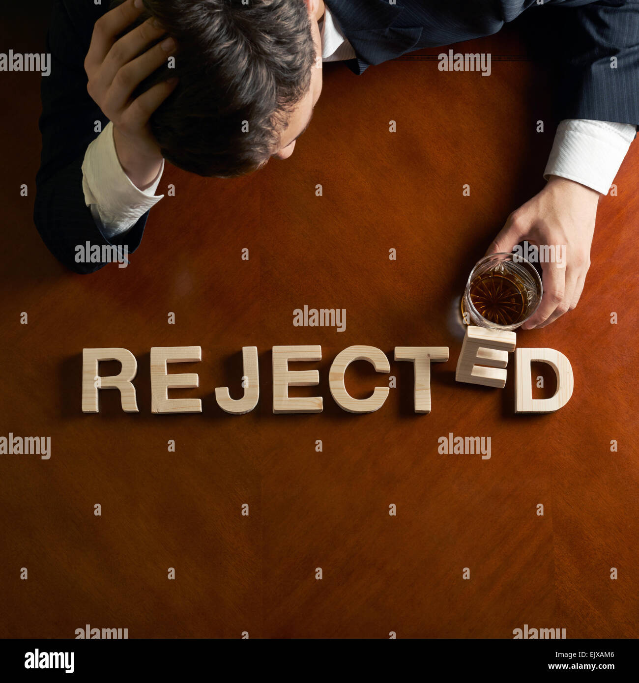 Word Rejected and devastated man composition Stock Photo - Alamy