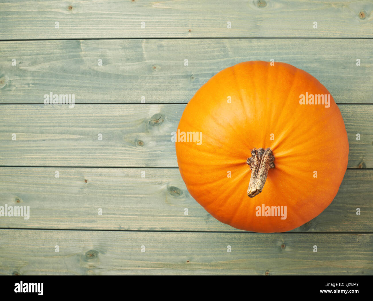 Orange pumpkin over the wooden boards Stock Photo - Alamy