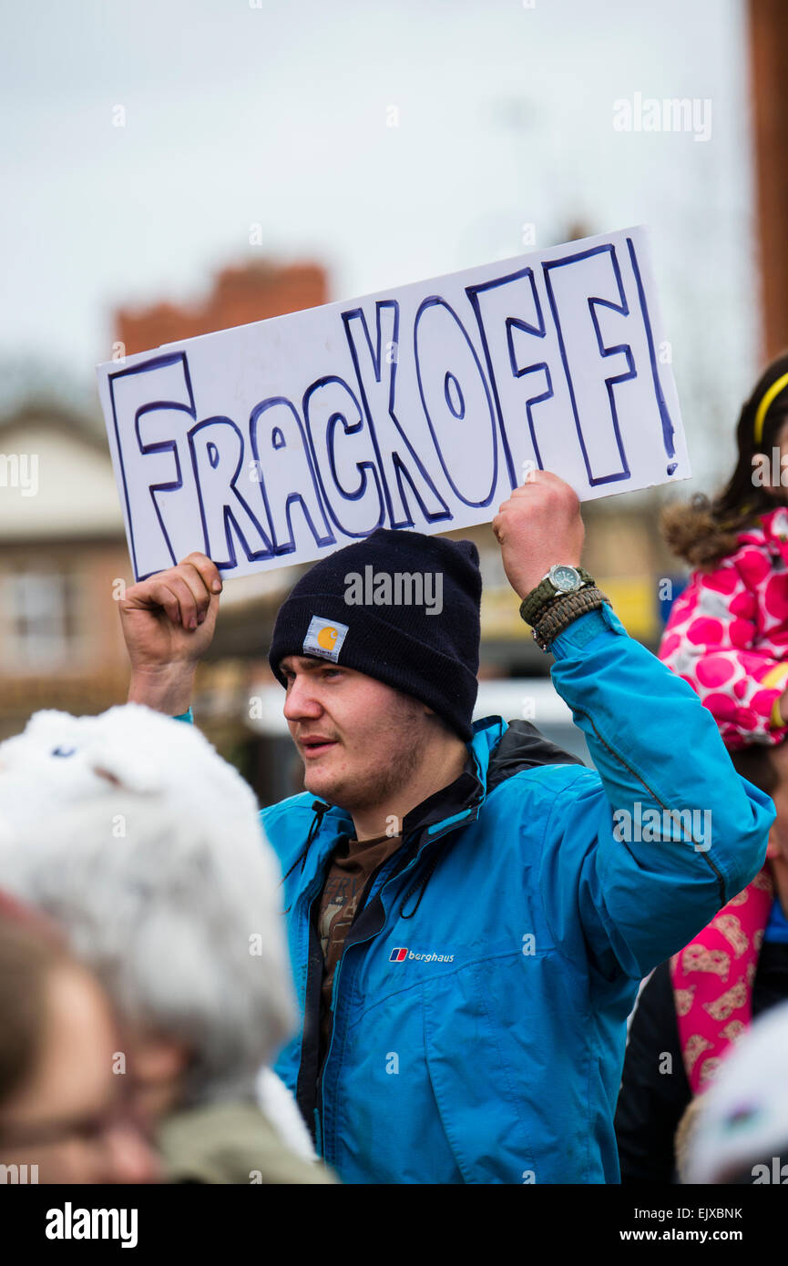 Environmentalism - Frack Off : a man holding banner and placard taking ...