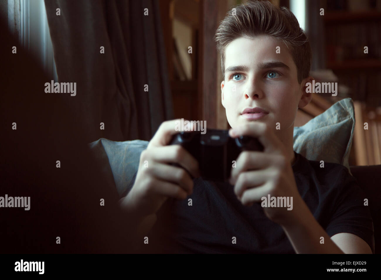 Boy playing video game hi-res stock photography and images - Alamy