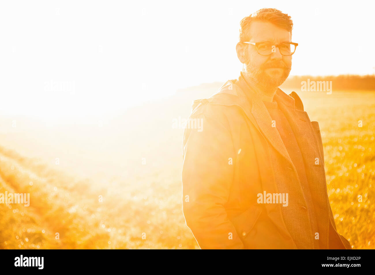 Man standing in a field hi-res stock photography and images - Alamy
