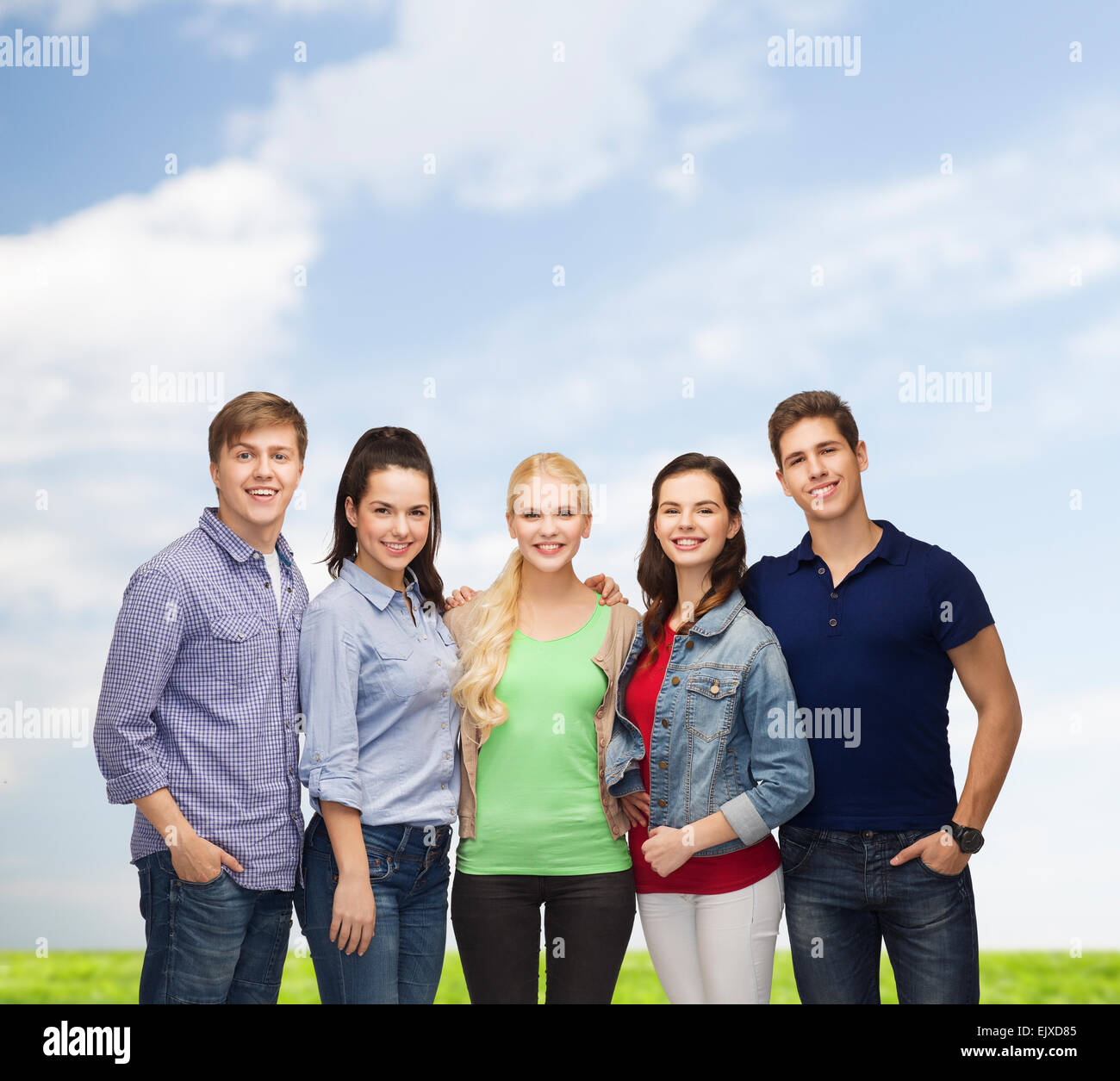 group of standing smiling students Stock Photo - Alamy