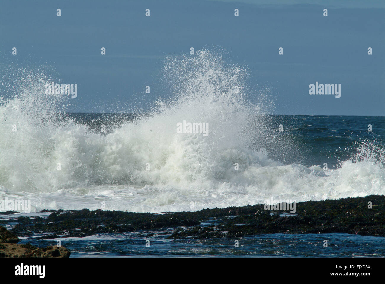Ocean waves crashing against the rocky coast of Donegal Ireland Stock ...