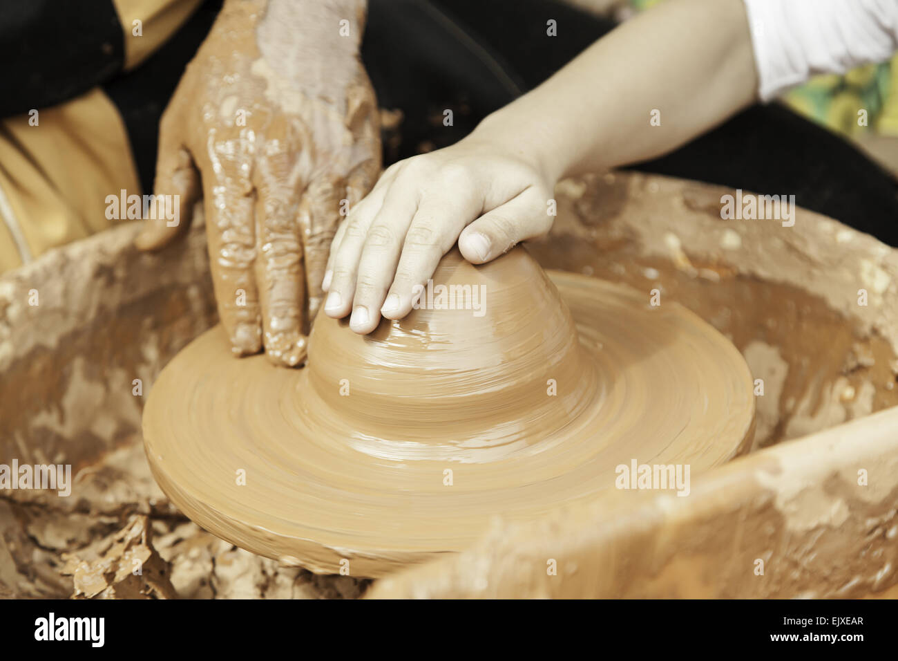 Traditional pottery, detail of a person shaping the clay Stock Photo ...