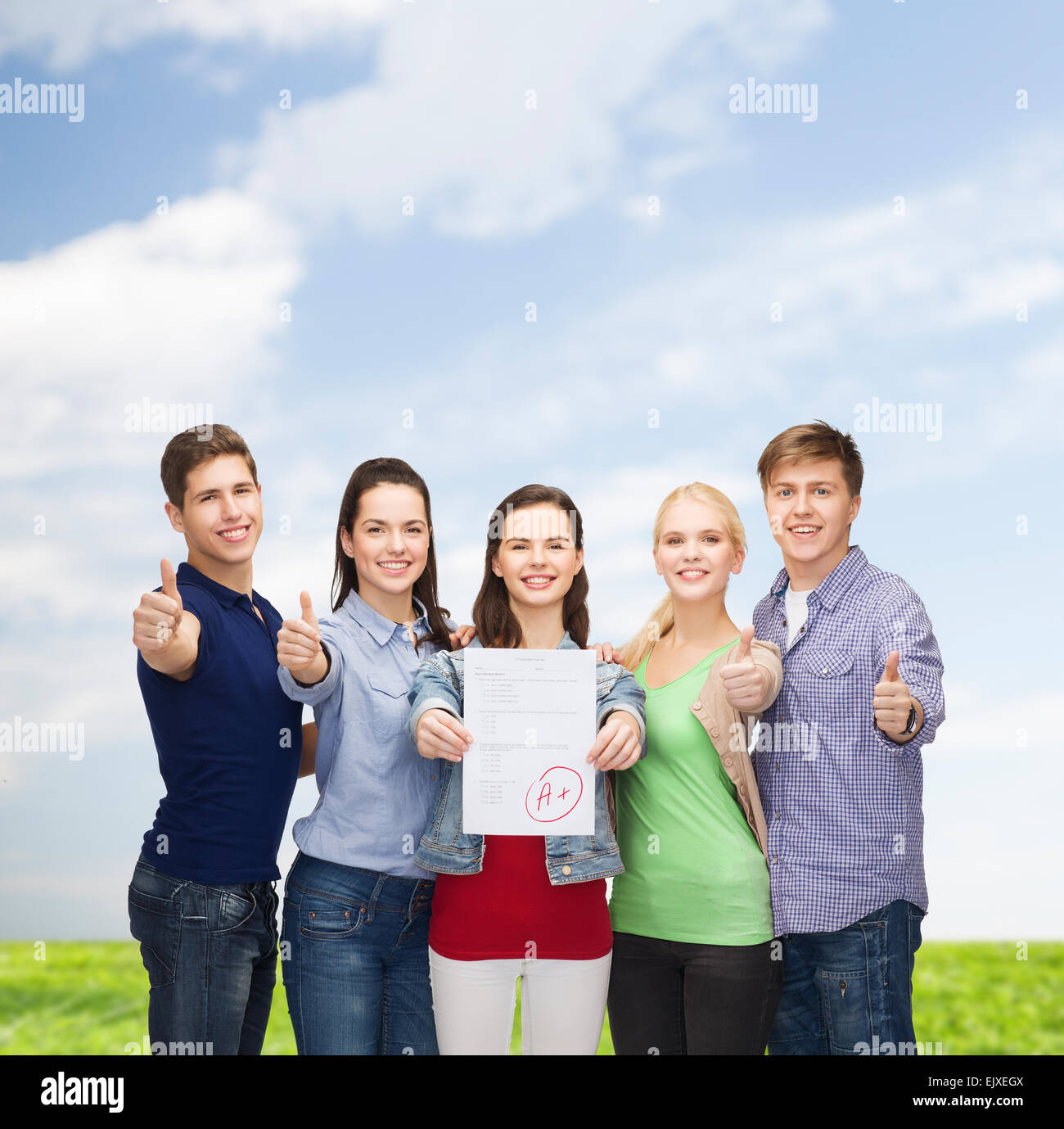 Group students showing test thumbs hi-res stock photography and images ...