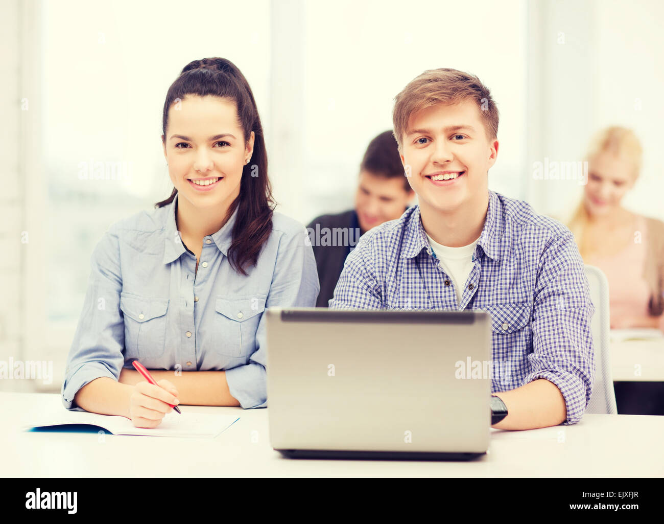 students with laptop and notebooks at school Stock Photo - Alamy