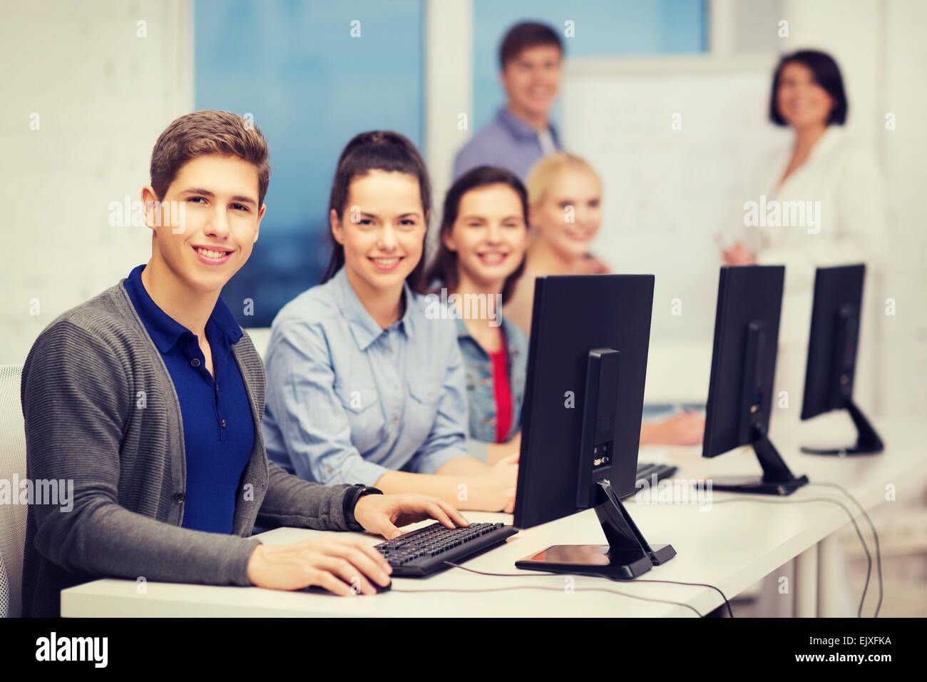 students with computer monitor at school Stock Photo - Alamy