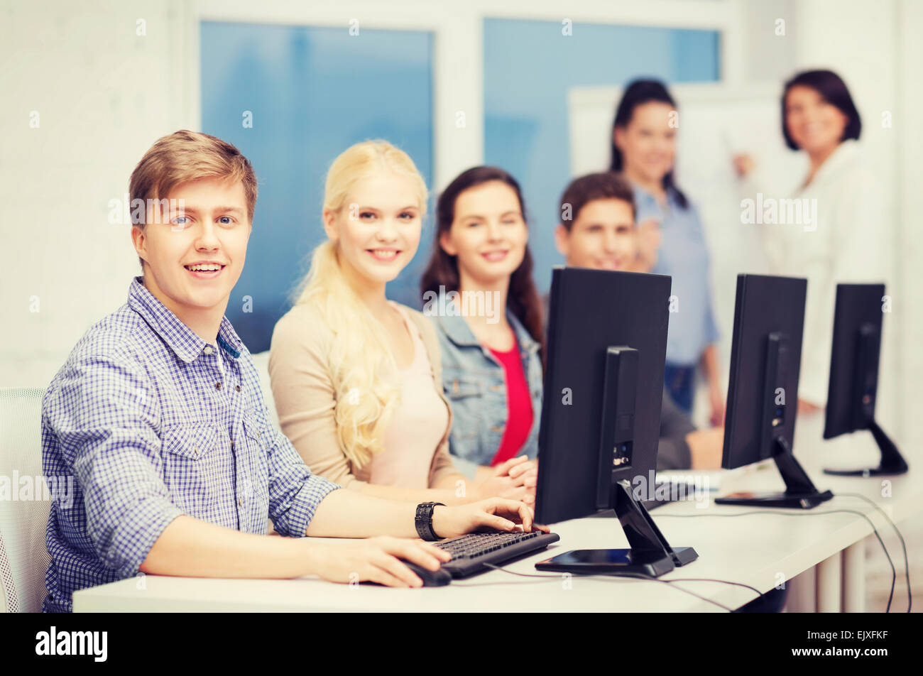 students with computer monitor at school Stock Photo - Alamy