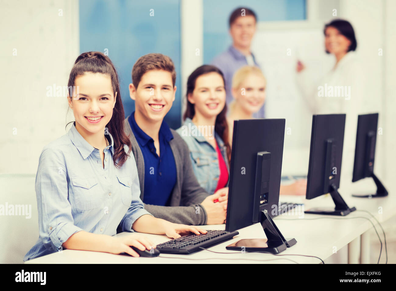 students with computer monitor at school Stock Photo - Alamy