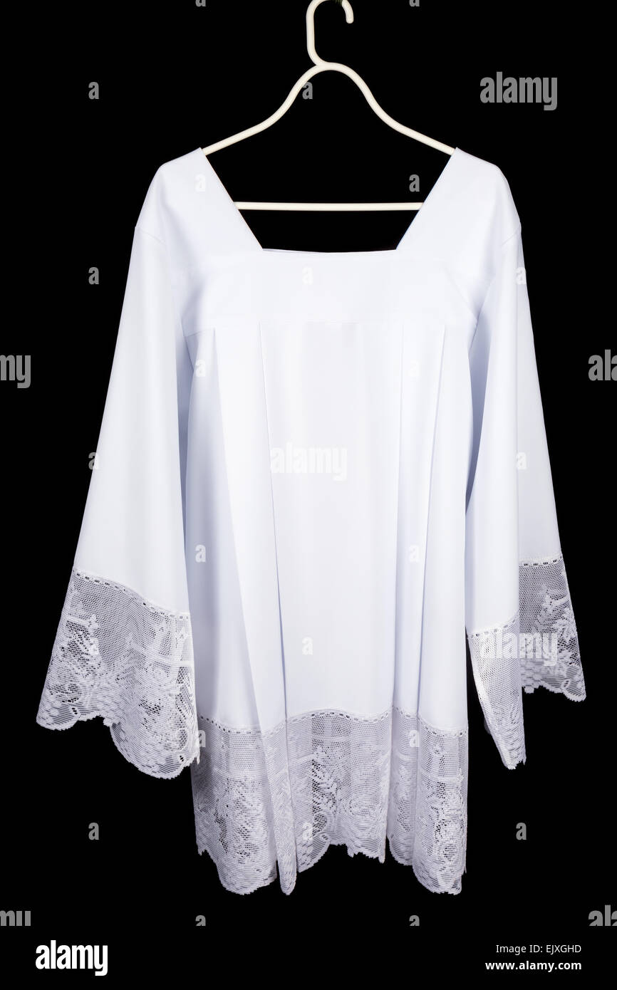 White lace surplice or chorrock as worn over a cassock by priests ...
