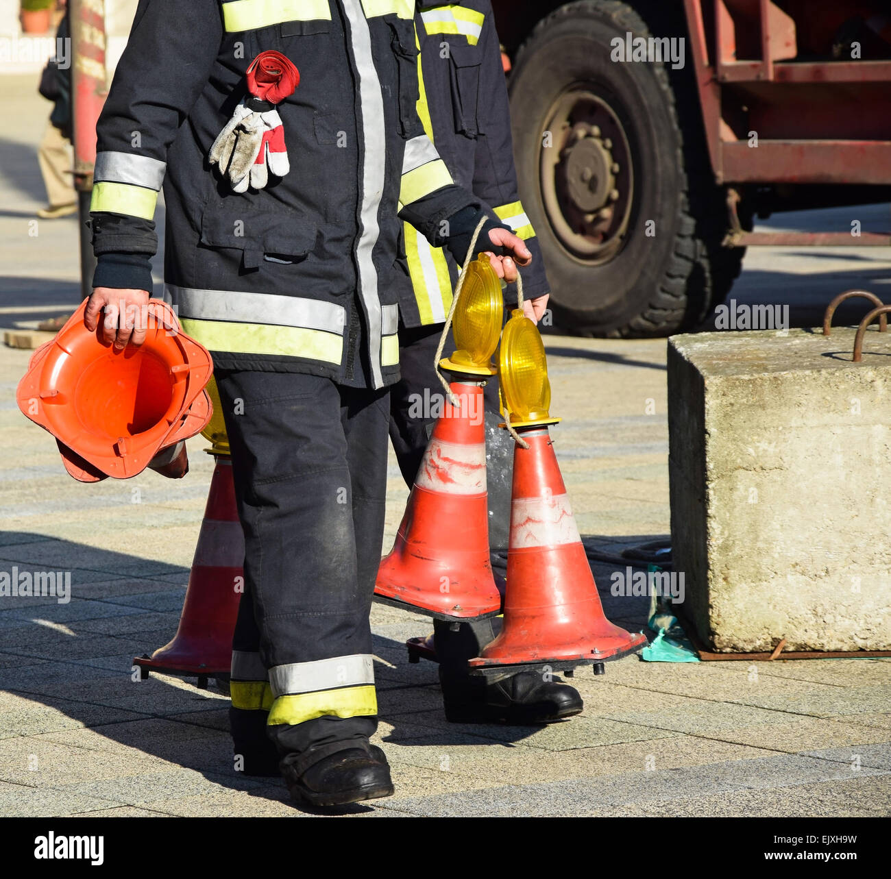 Firefighters with traffic cones Stock Photo - Alamy