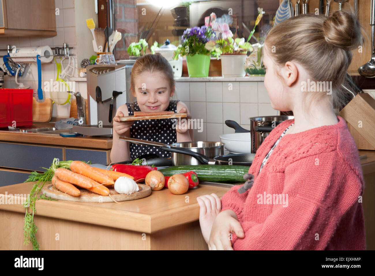 Two sisters cooking together hi-res stock photography and images - Alamy