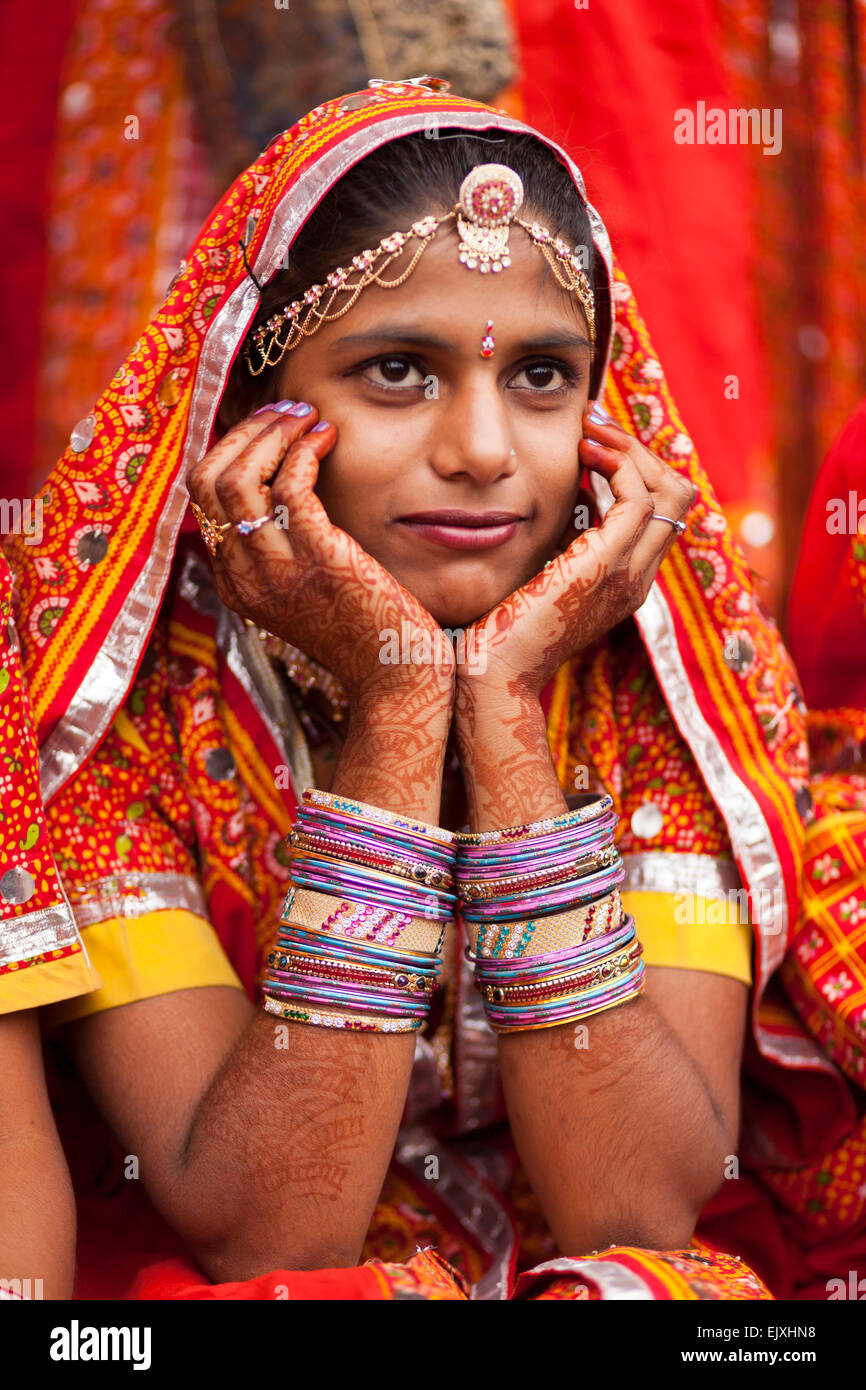 India, Rajasthan, Pushkar, portrait of young woman at camel market ...