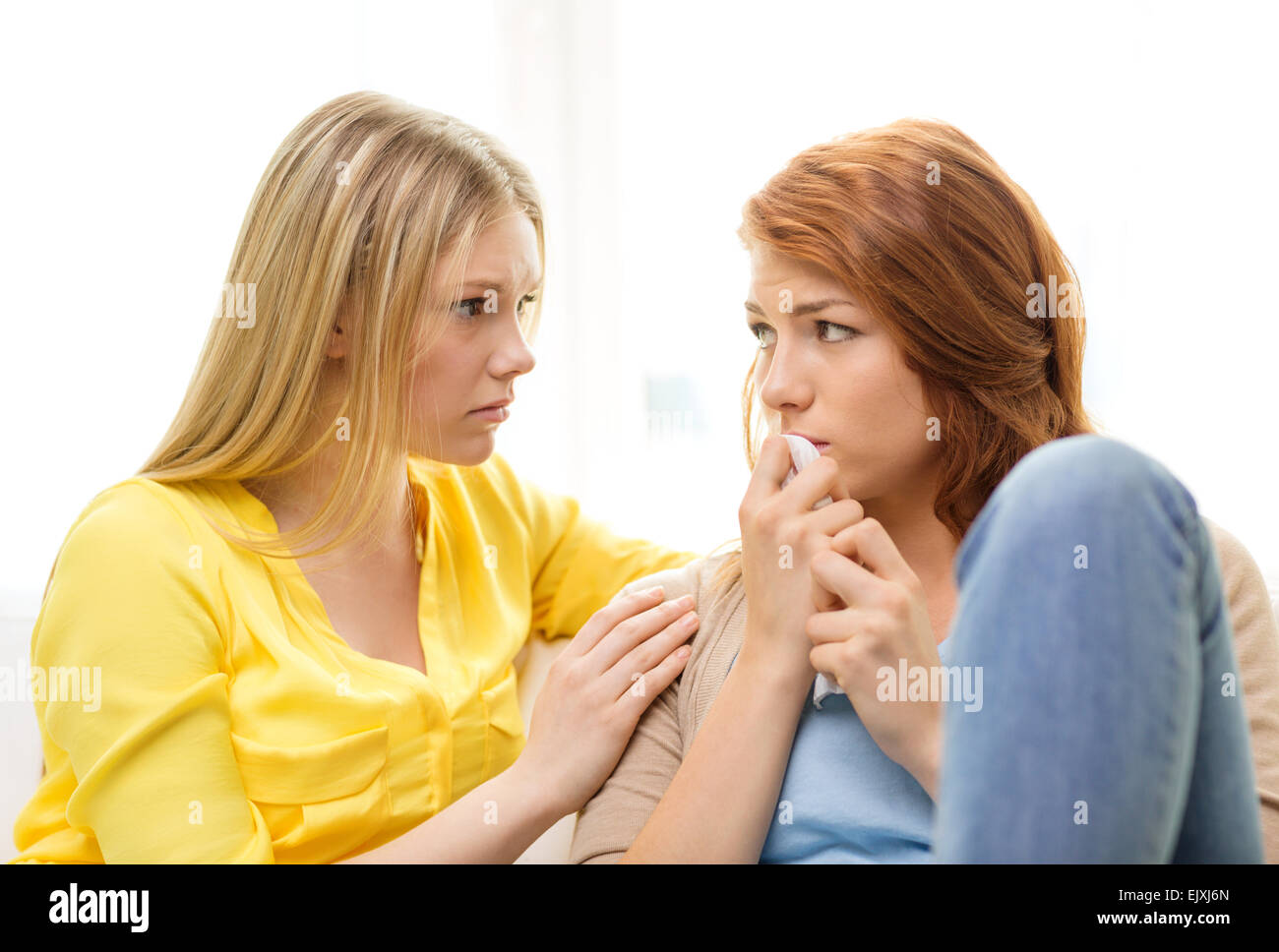 one teenage girl comforting another after break up Stock Photo - Alamy