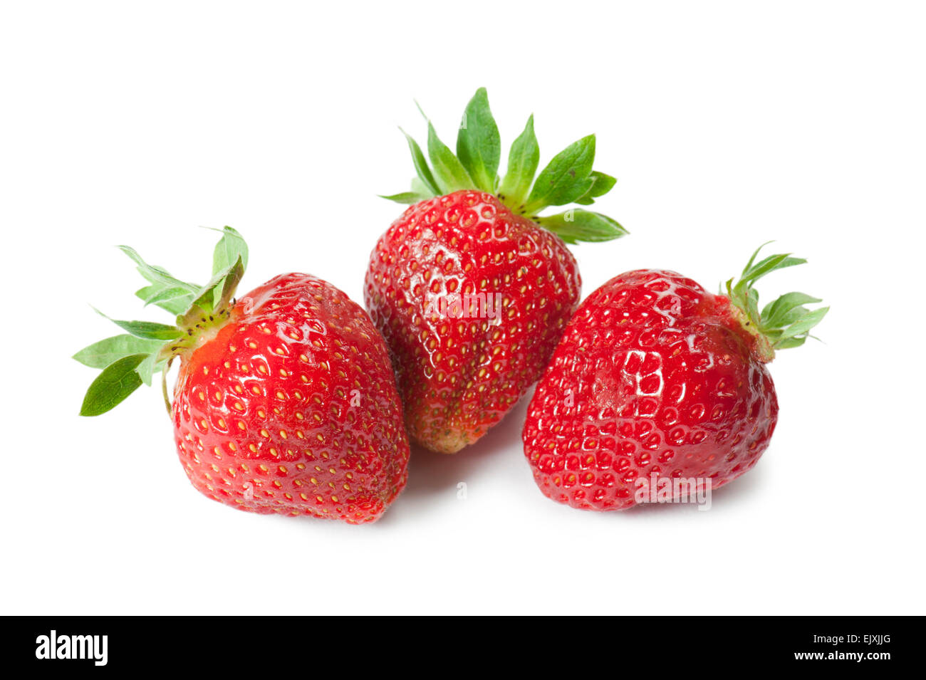 three ripe strawberries, on white background Stock Photo - Alamy
