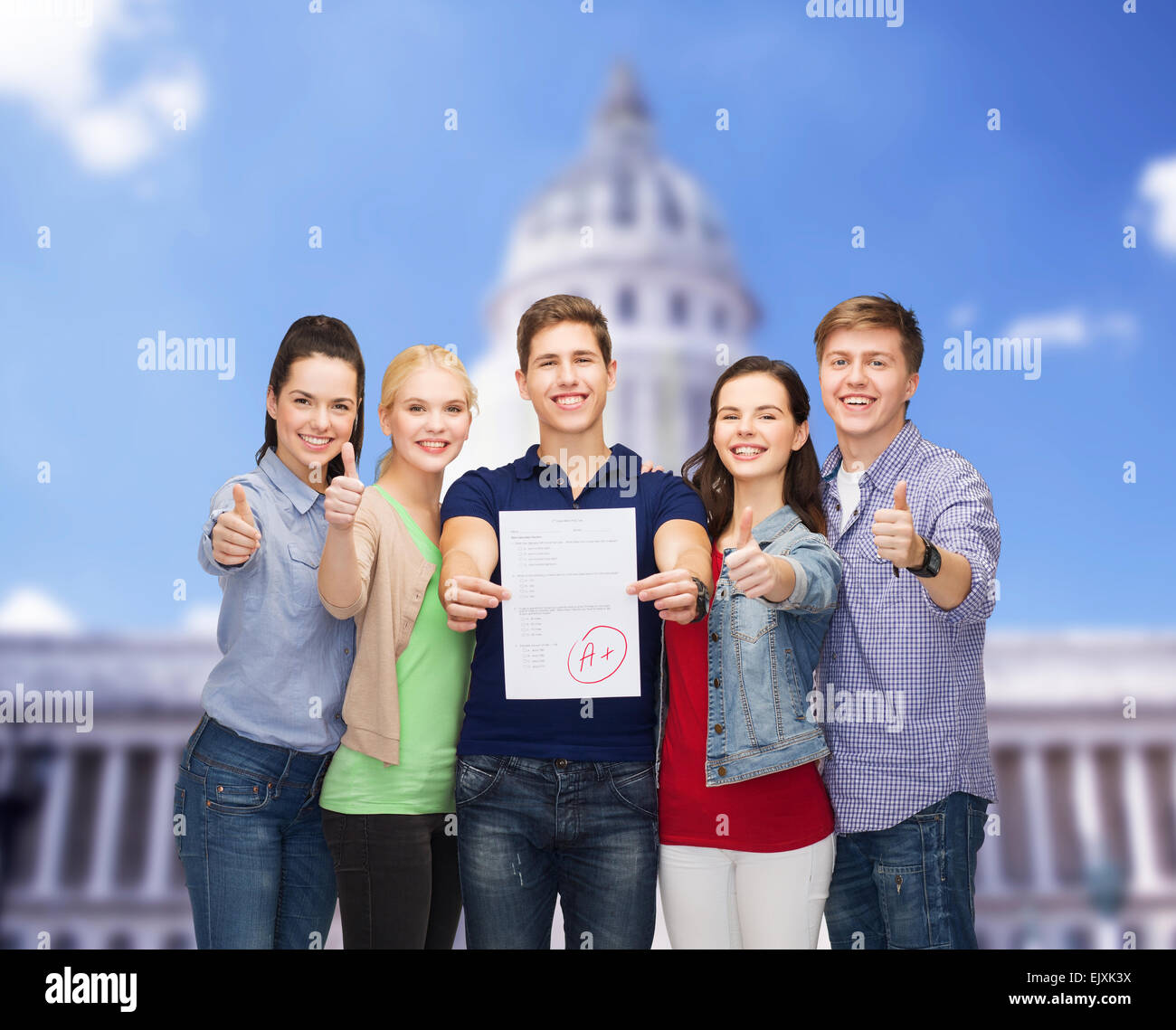group of students showing test and thumbs up Stock Photo - Alamy