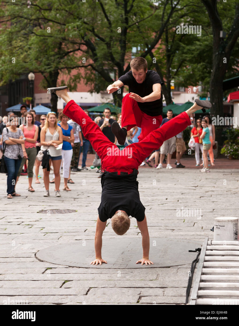 Street acrobats from The Red Trouser Show, performing in front of ...