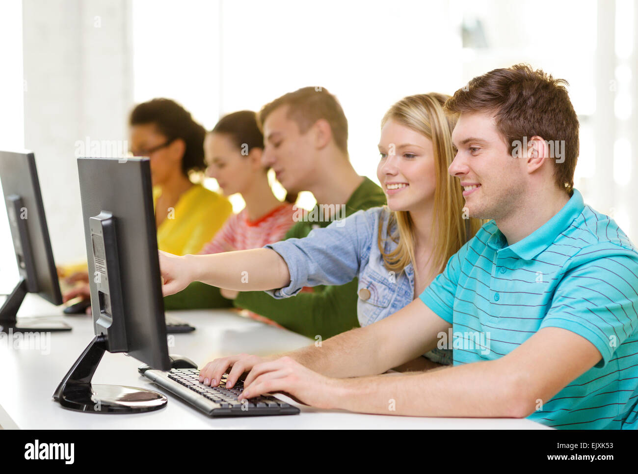 smiling students in computer class at school Stock Photo - Alamy