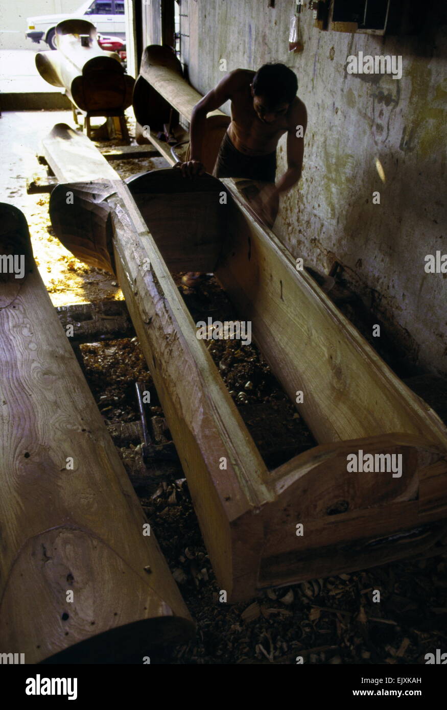 AJAXNETPHOTO - BANGKOK, THAILAND. - A COFFIN MAKER AT WORK IN ONE OF ...
