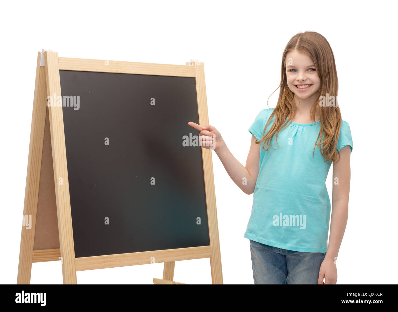 happy little girl pointing finger to blackboard Stock Photo - Alamy
