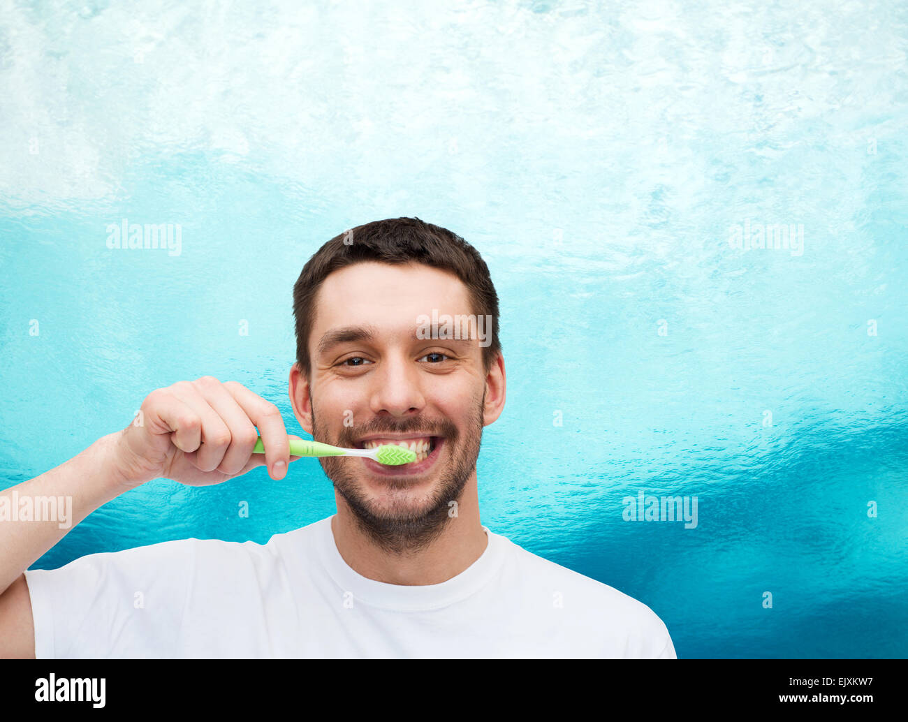 smiling young man with toothbrush Stock Photo - Alamy